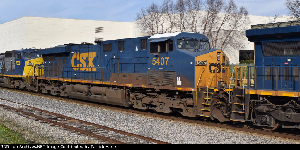 CSX 5407 ES40DC trails CSX 7791 C40-8W ahead of CSX 7308 X-CR 6072 C40-8W and CSX 5468 ES40DC ...